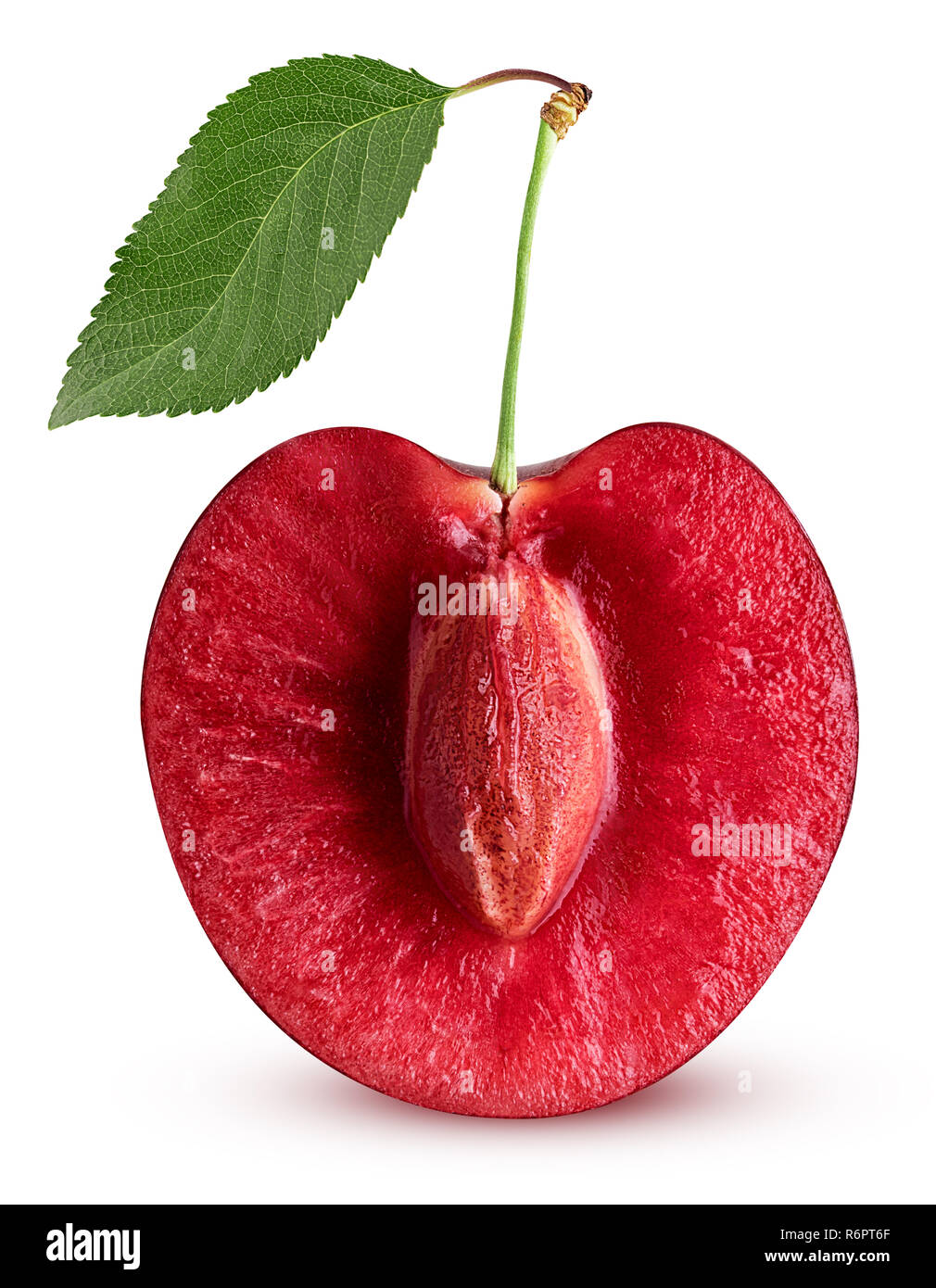 Sweet cherry berry cut in half with bone and green leaf isolated on ...