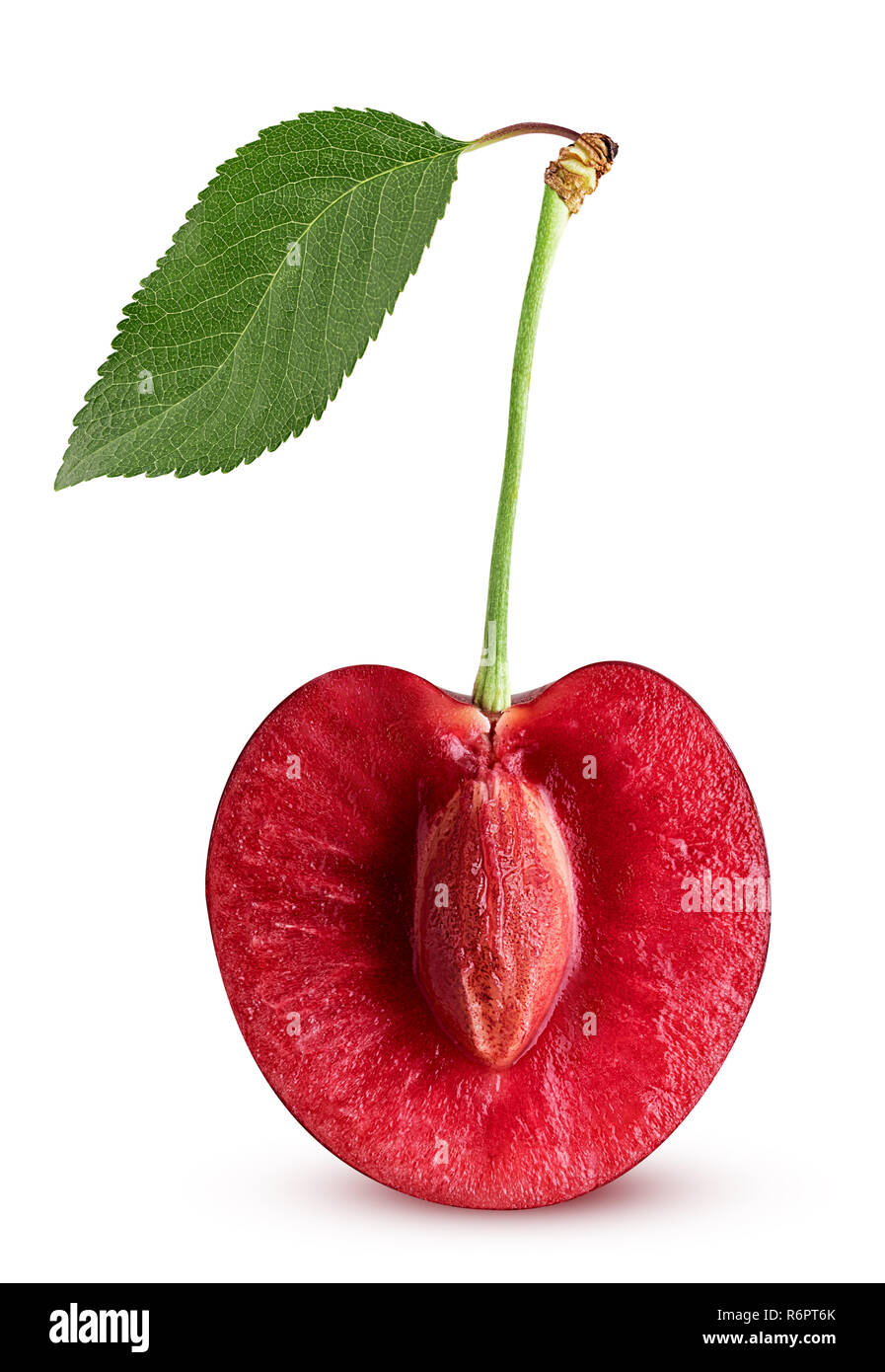 Sweet cherry berry cut in half with bone and green leaf isolated on ...