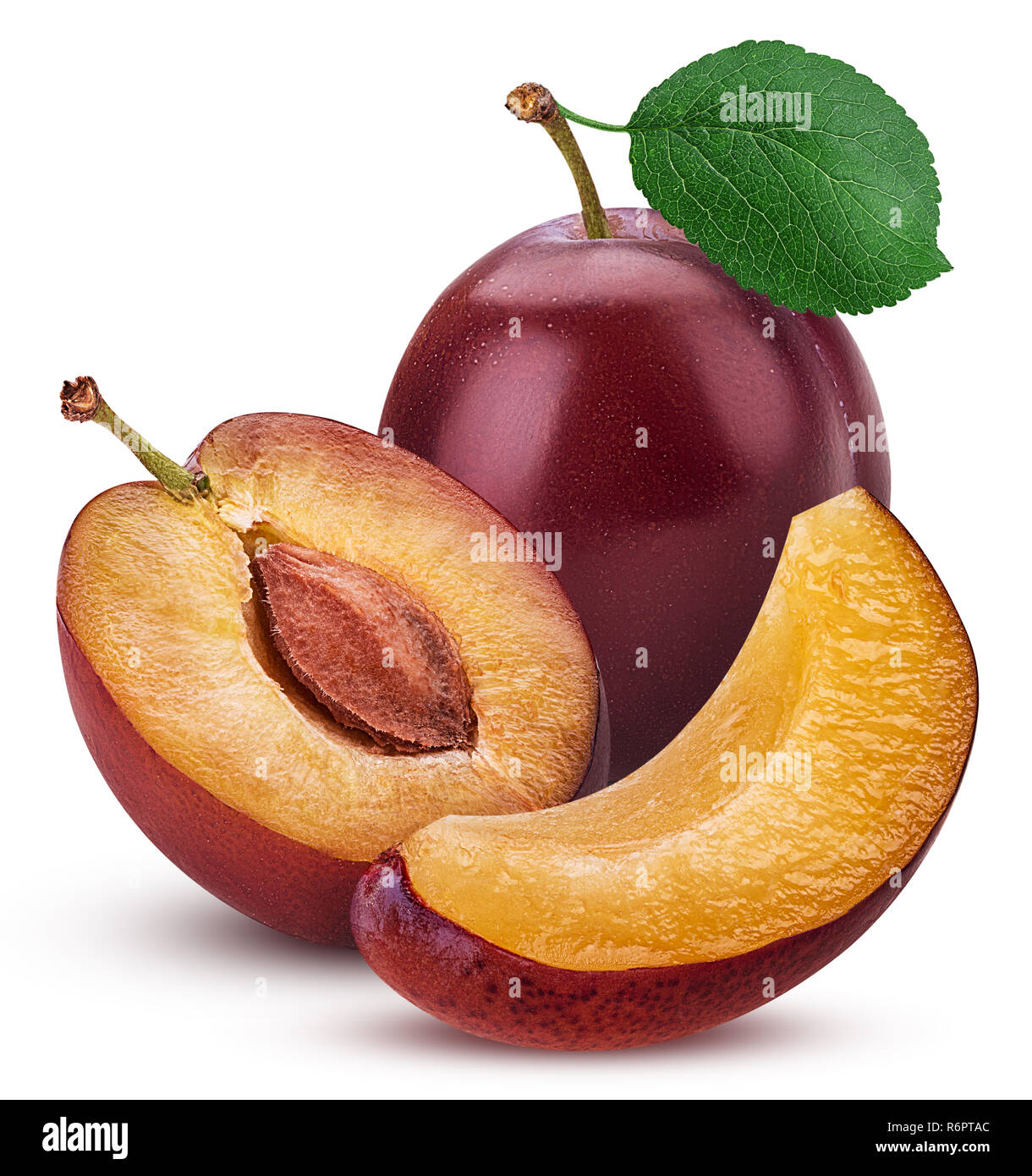 Fresh plum one cut in half with bone and slice with leaf isolated on ...