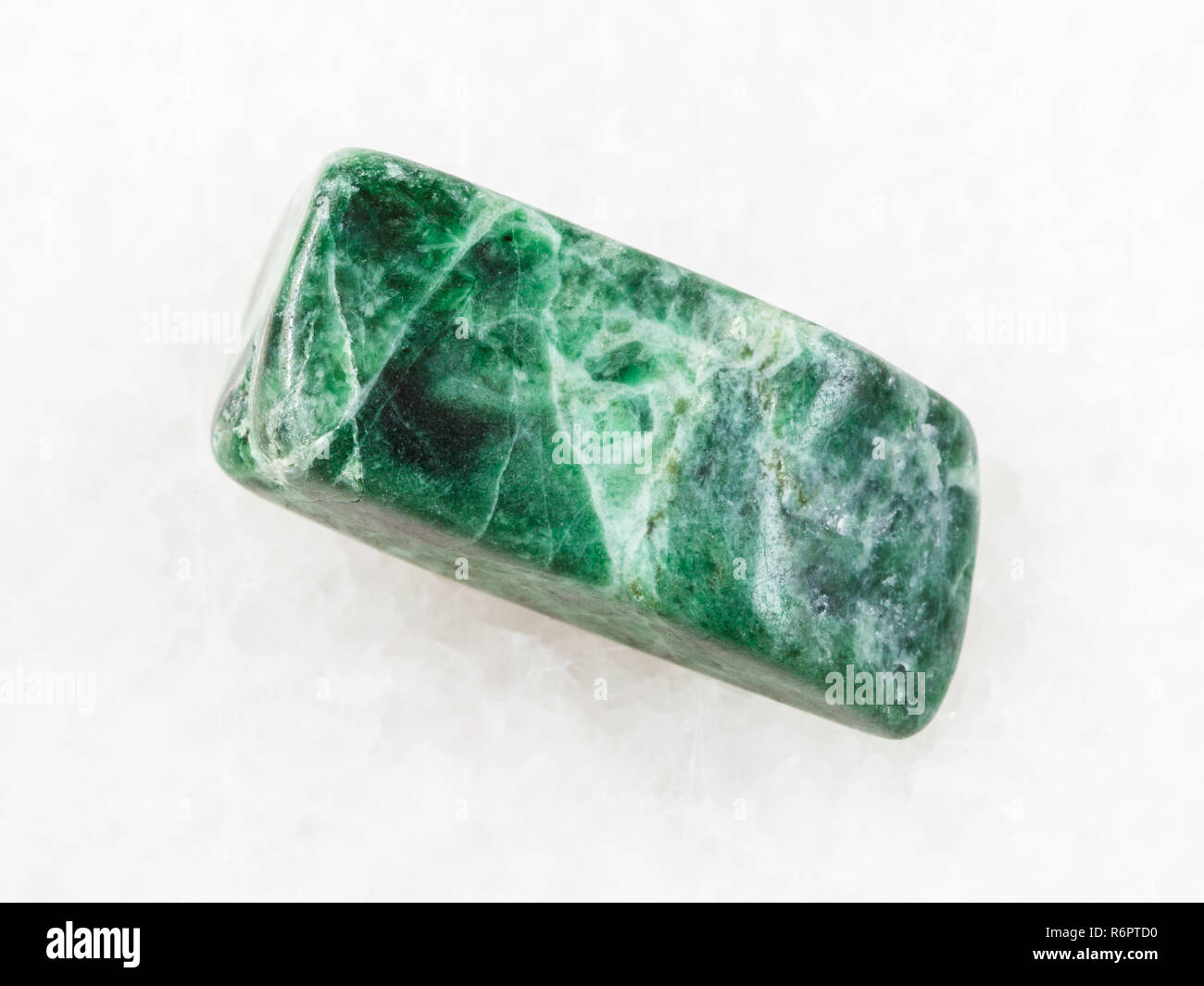 tumbled green jadeite stone on white marble Stock Photo - Alamy