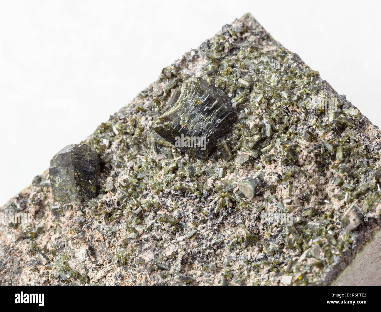 crystals of Epidote on rock close up on white Stock Photo - Alamy