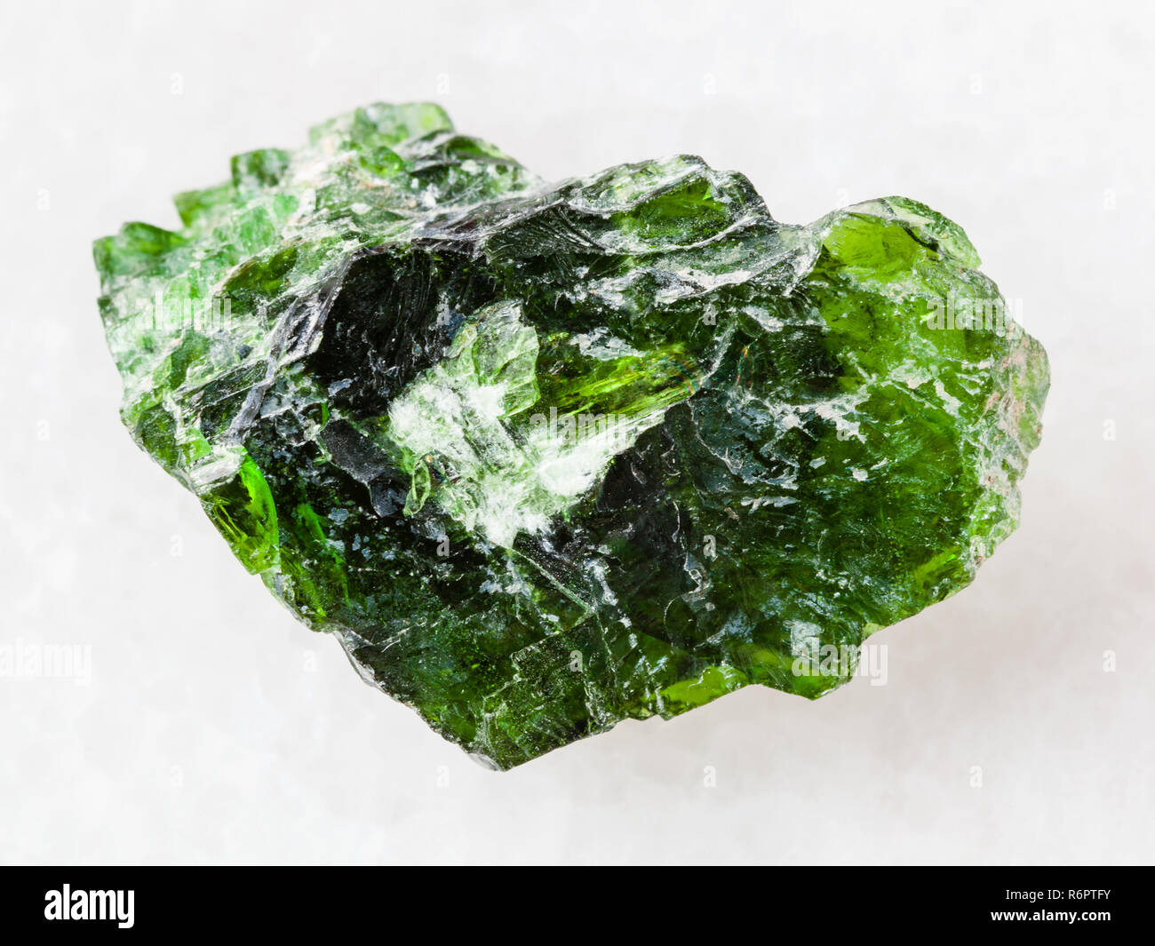 rough crystal of Chrome Diopside gemstone on white Stock Photo - Alamy