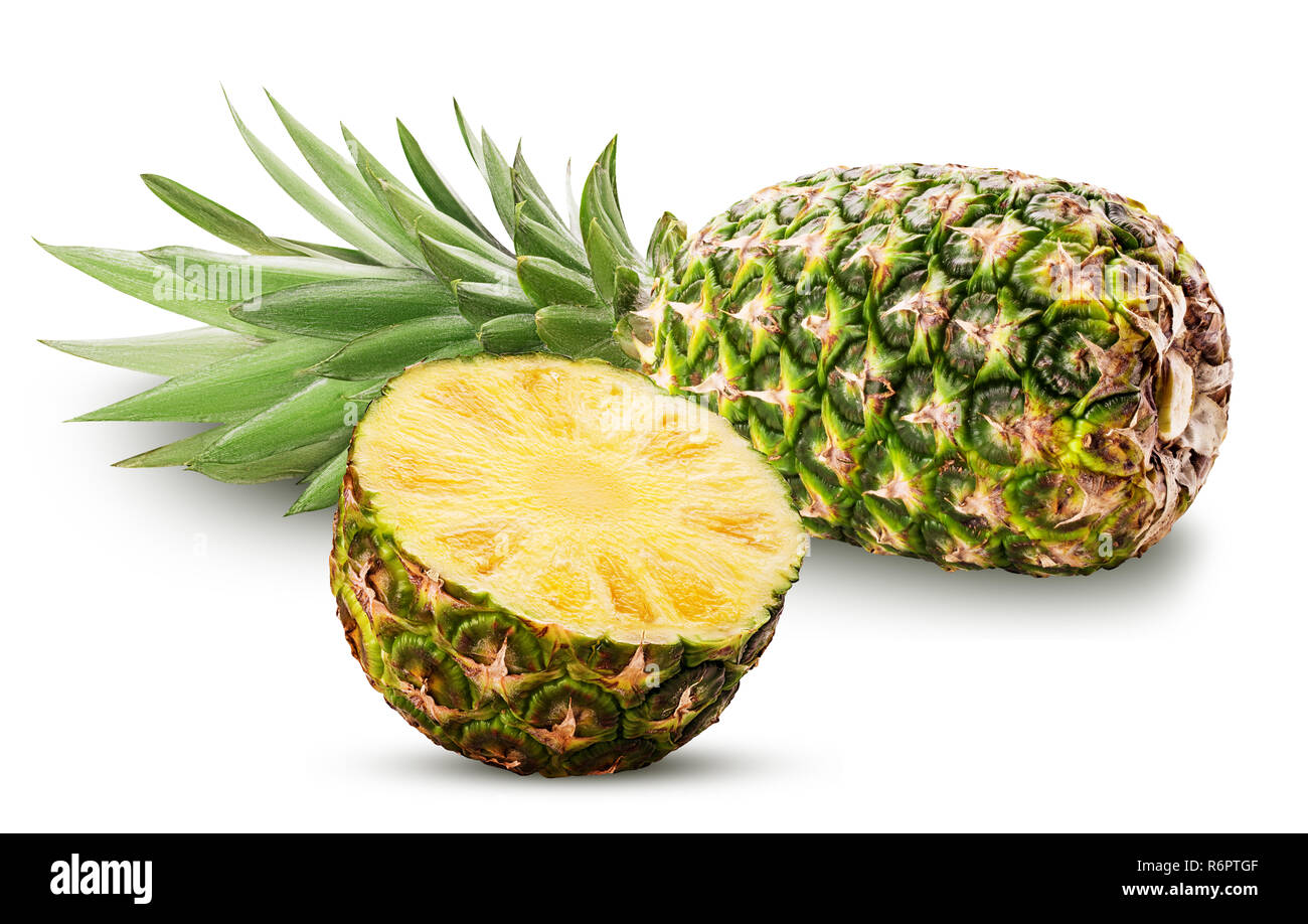 Pineapple fruit whole and cut in half with green leaves isolated on ...