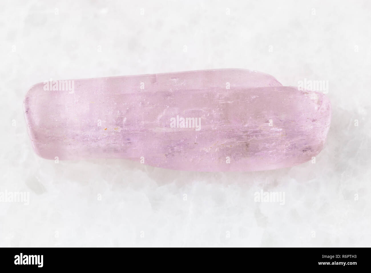 tumbled kunzite gemstone on white Stock Photo - Alamy