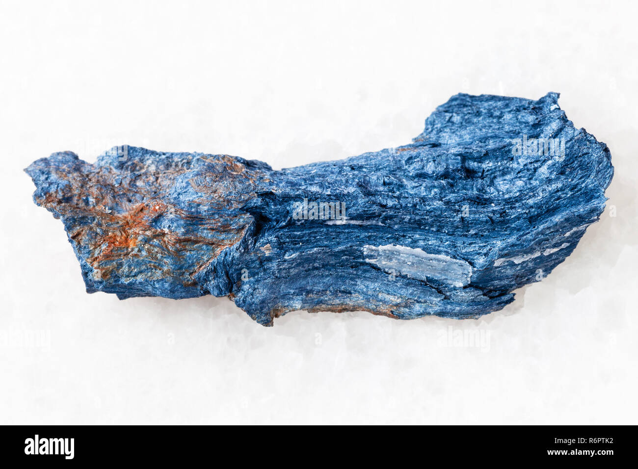 rough Rhodusite stone on white marble Stock Photo - Alamy