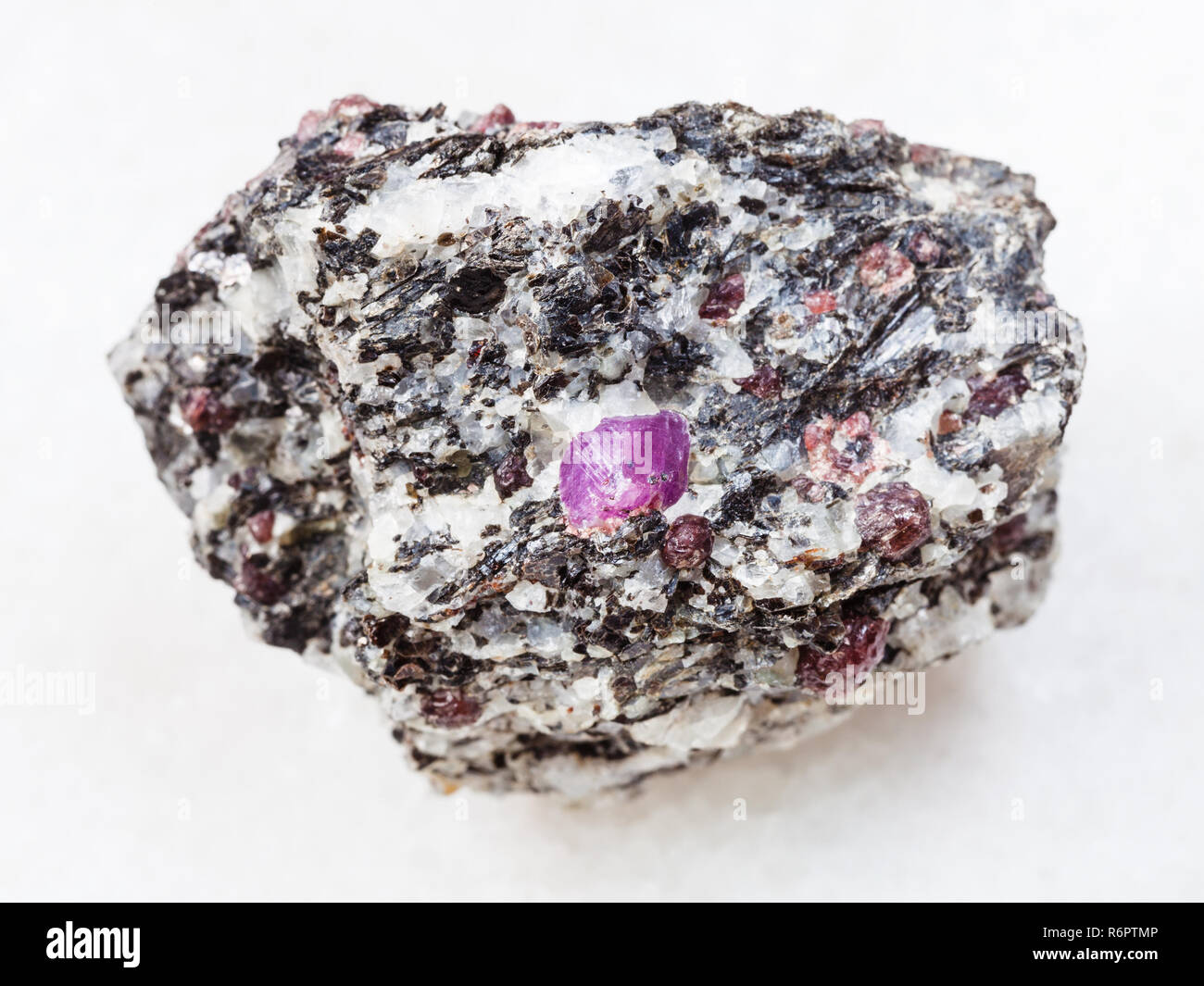 raw corundum crystals in gneiss stone on white Stock Photo - Alamy