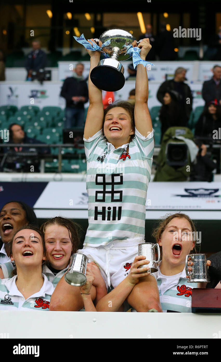 Cambridge captain Kate Marks (centre) lifts the trophy after winning ...