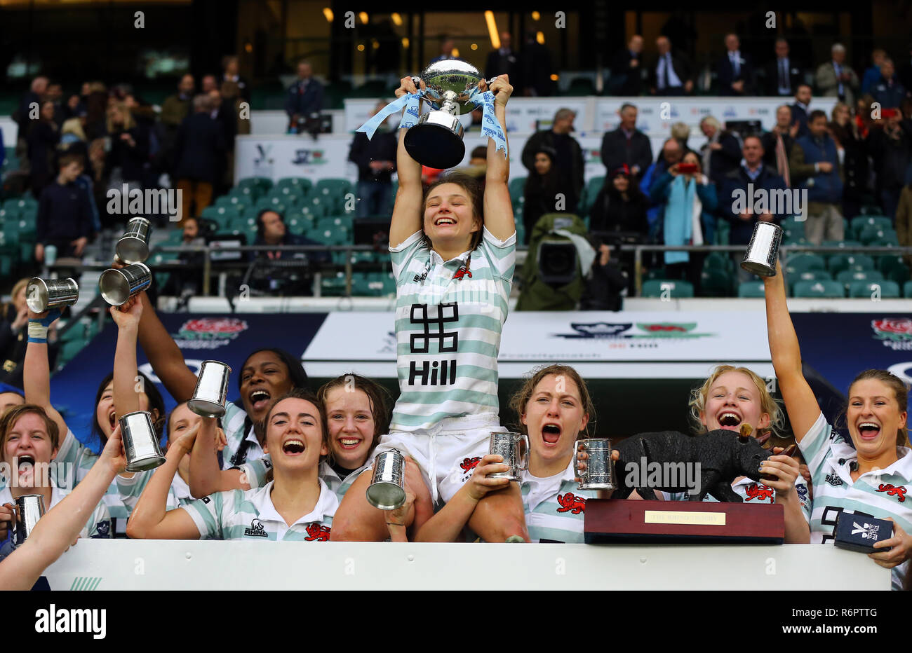 Cambridge captain Kate Marks (centre) lifts the trophy after winning ...