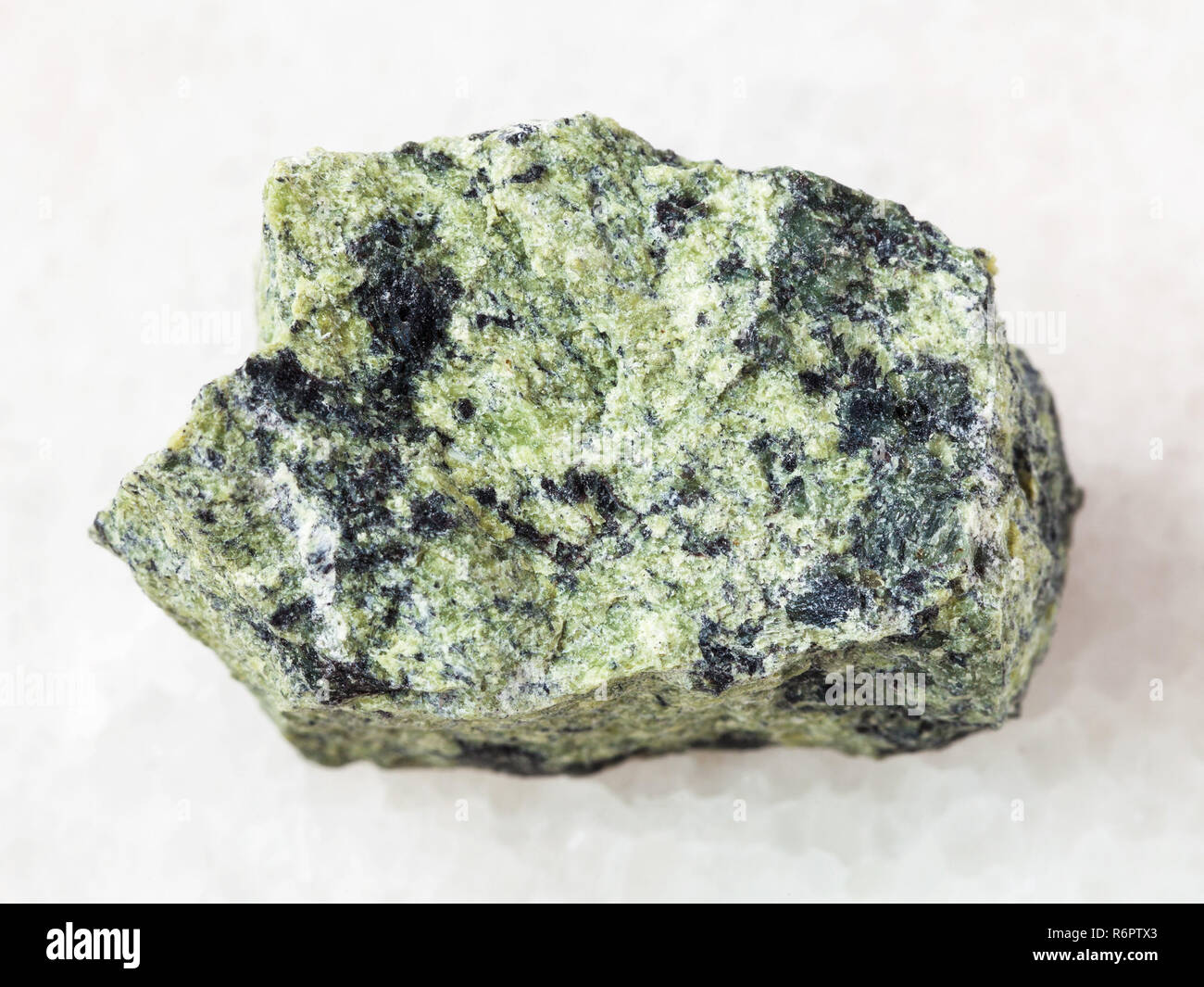 raw serpentinite stone on white Stock Photo - Alamy