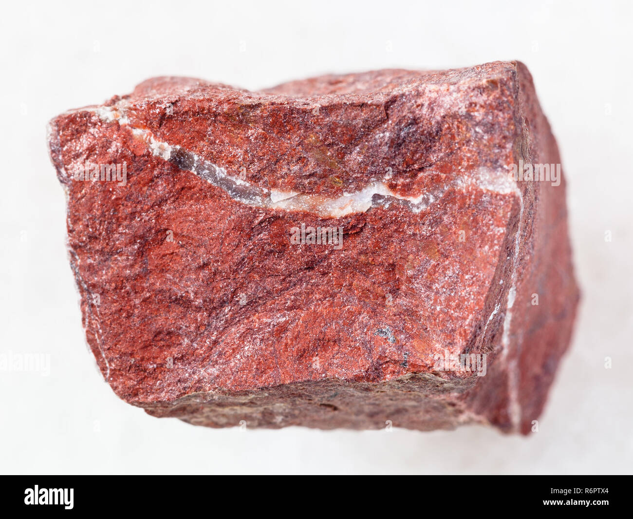 raw red jasper stone on white Stock Photo - Alamy