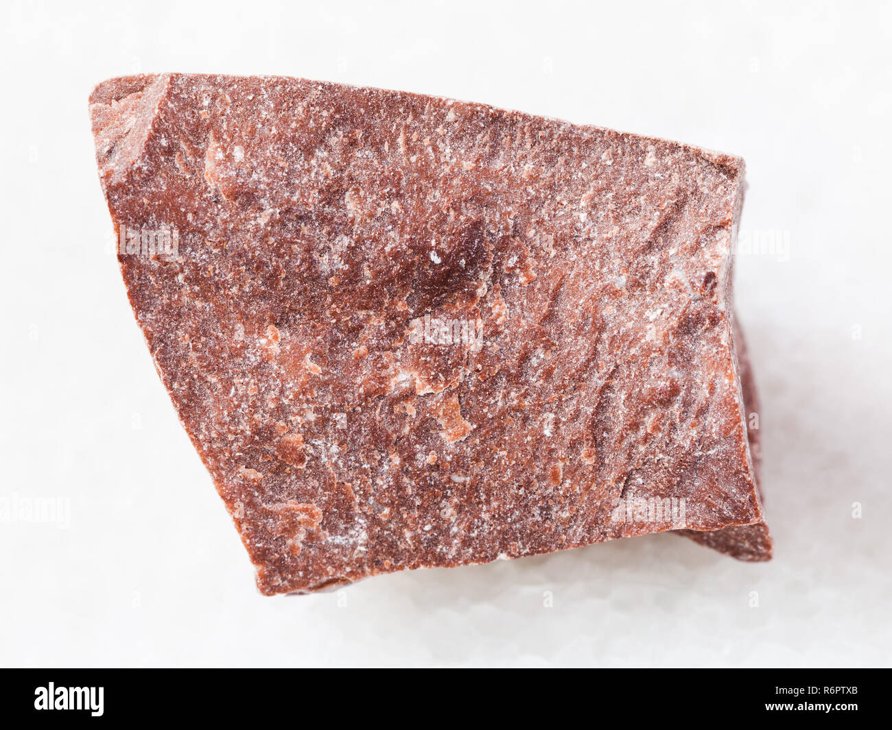 piece of raw red marble stone on white Stock Photo - Alamy