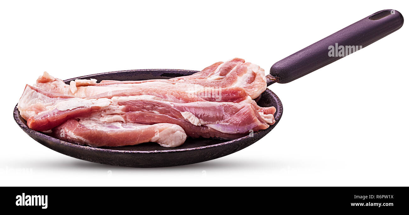 Raw meat in a frying pan isolated on white background. Clipping Path ...