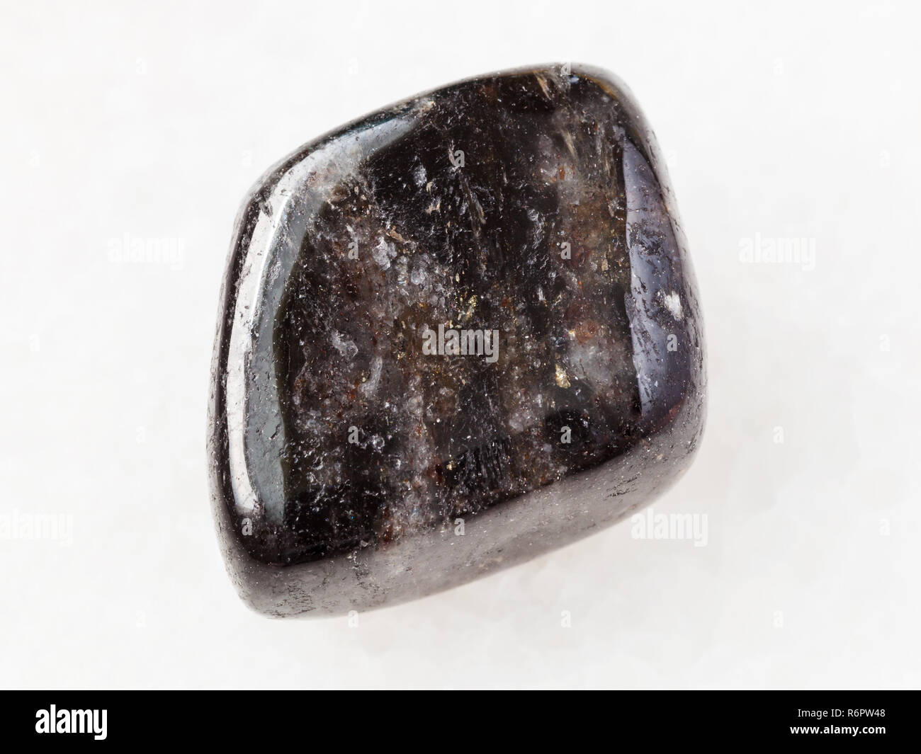 polished anthophyllite gemstone on white Stock Photo - Alamy