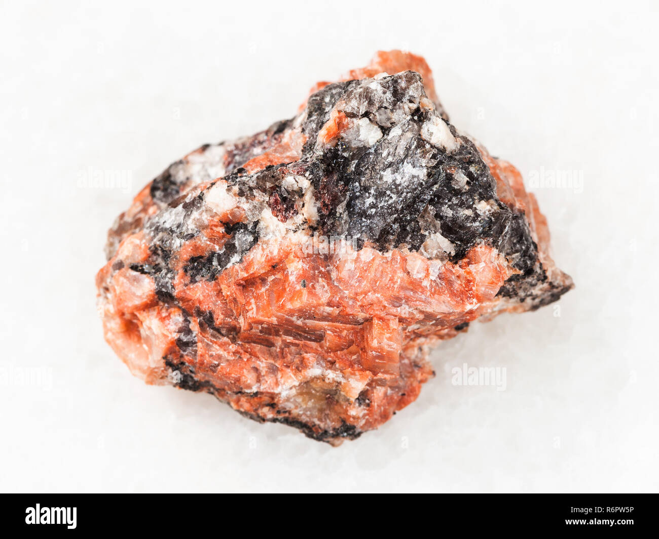 raw red granite stone on white Stock Photo - Alamy