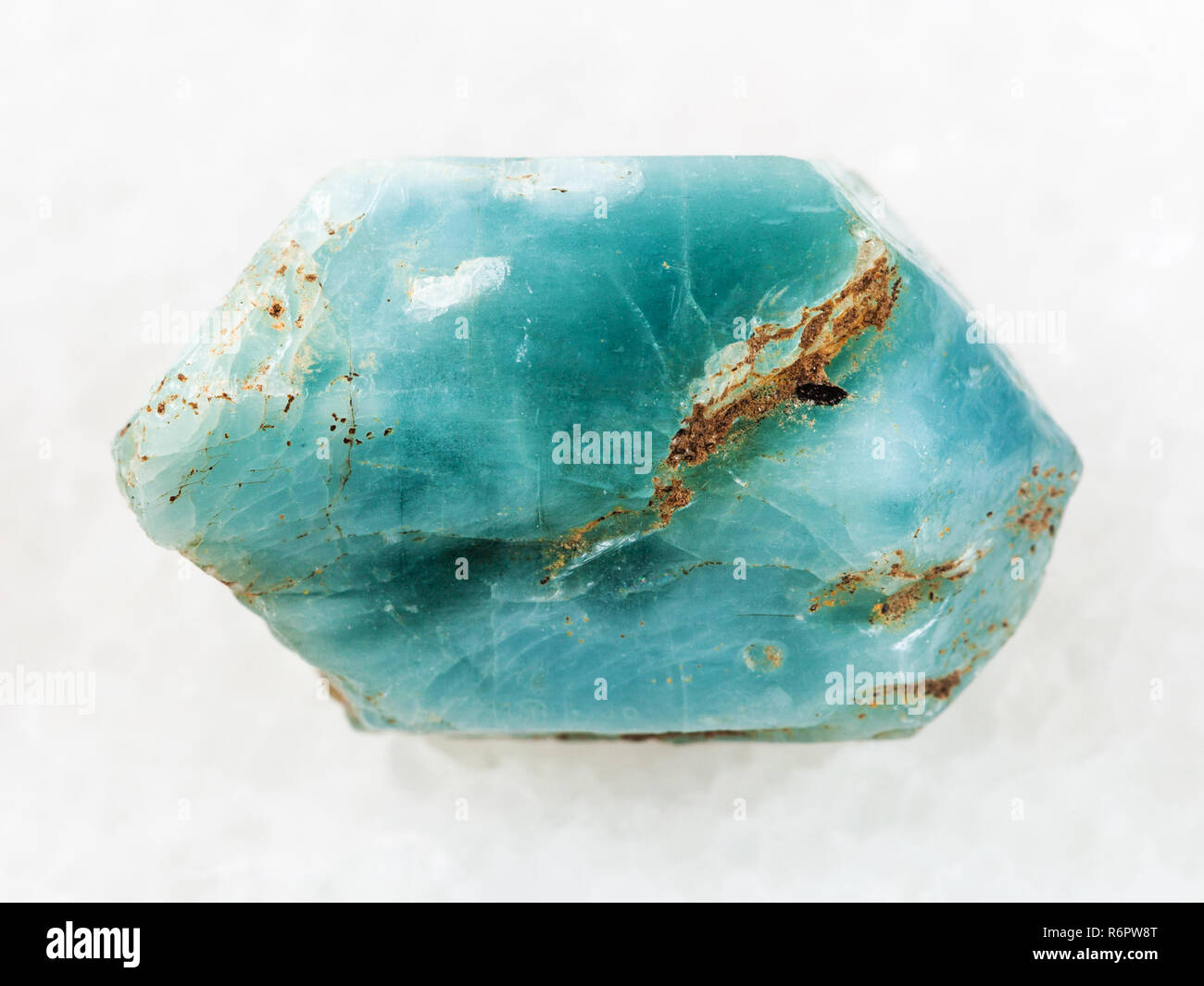 rough crystal of blue apatite gemstone on white Stock Photo - Alamy