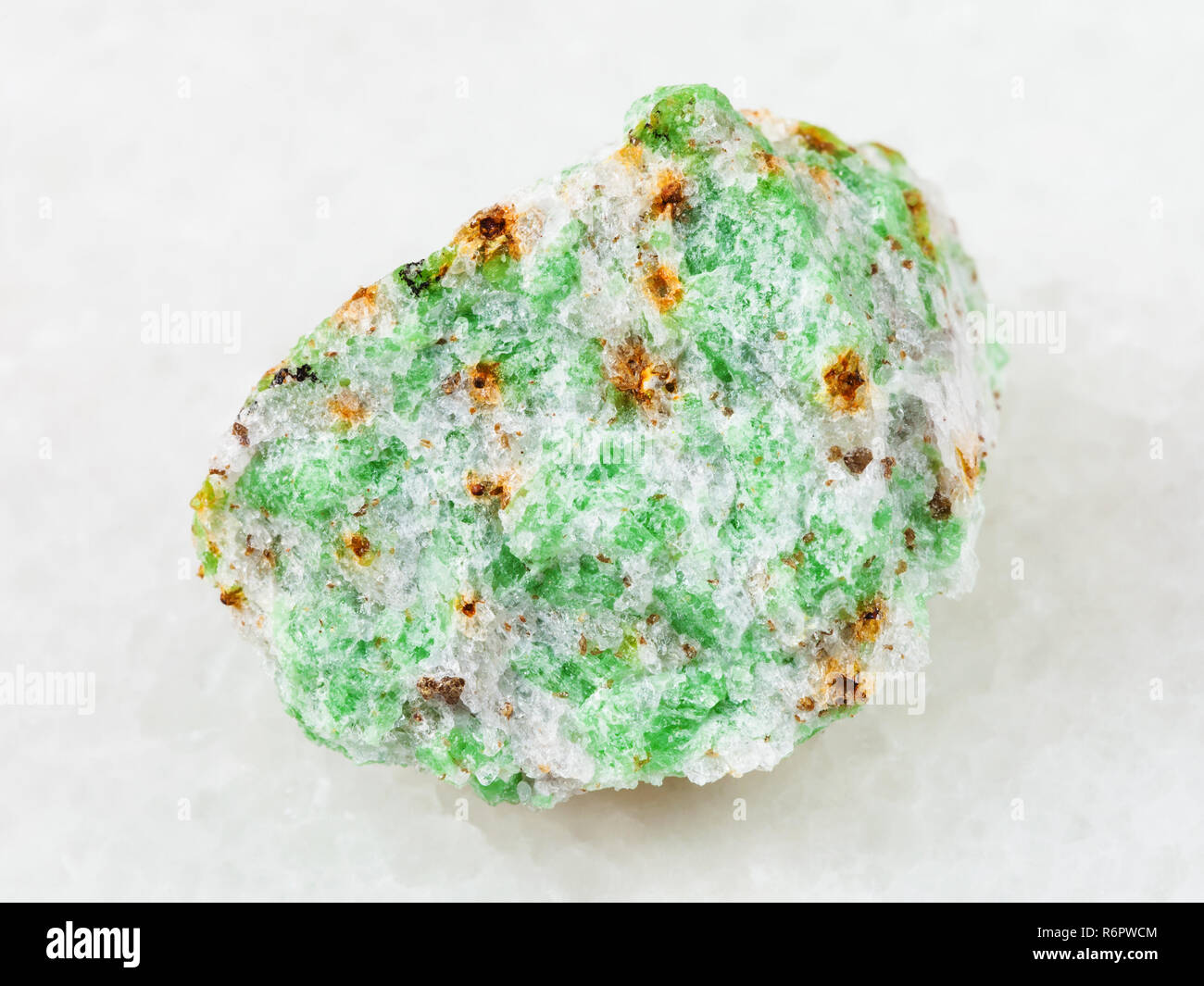 rough Edenite stone on white Stock Photo - Alamy