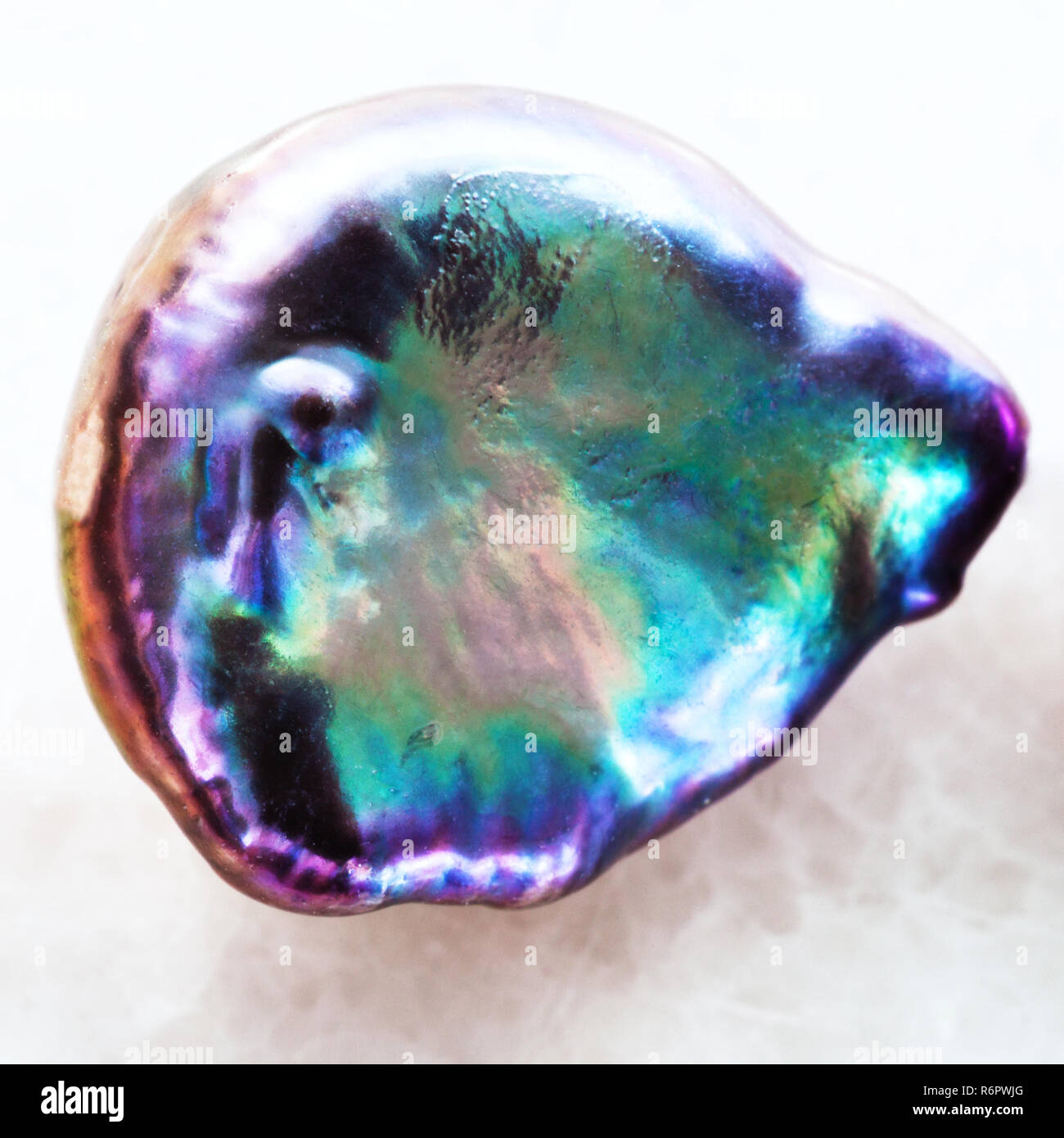 tumbled Abalone (haliotis) stone on white marble Stock Photo - Alamy