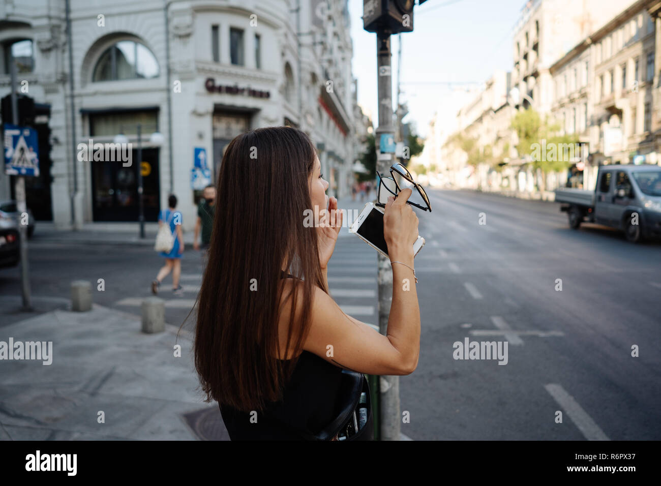 A beautiful young girl is standing at a crossroads Stock Photo - Alamy