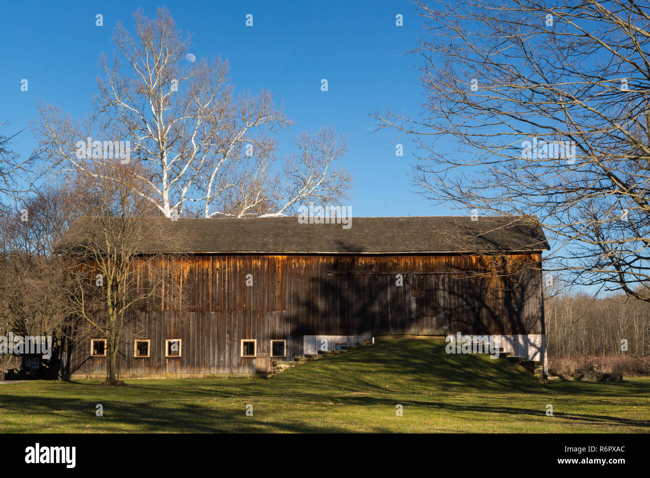 The moon rising above an old barn on the Stanford House property ...
