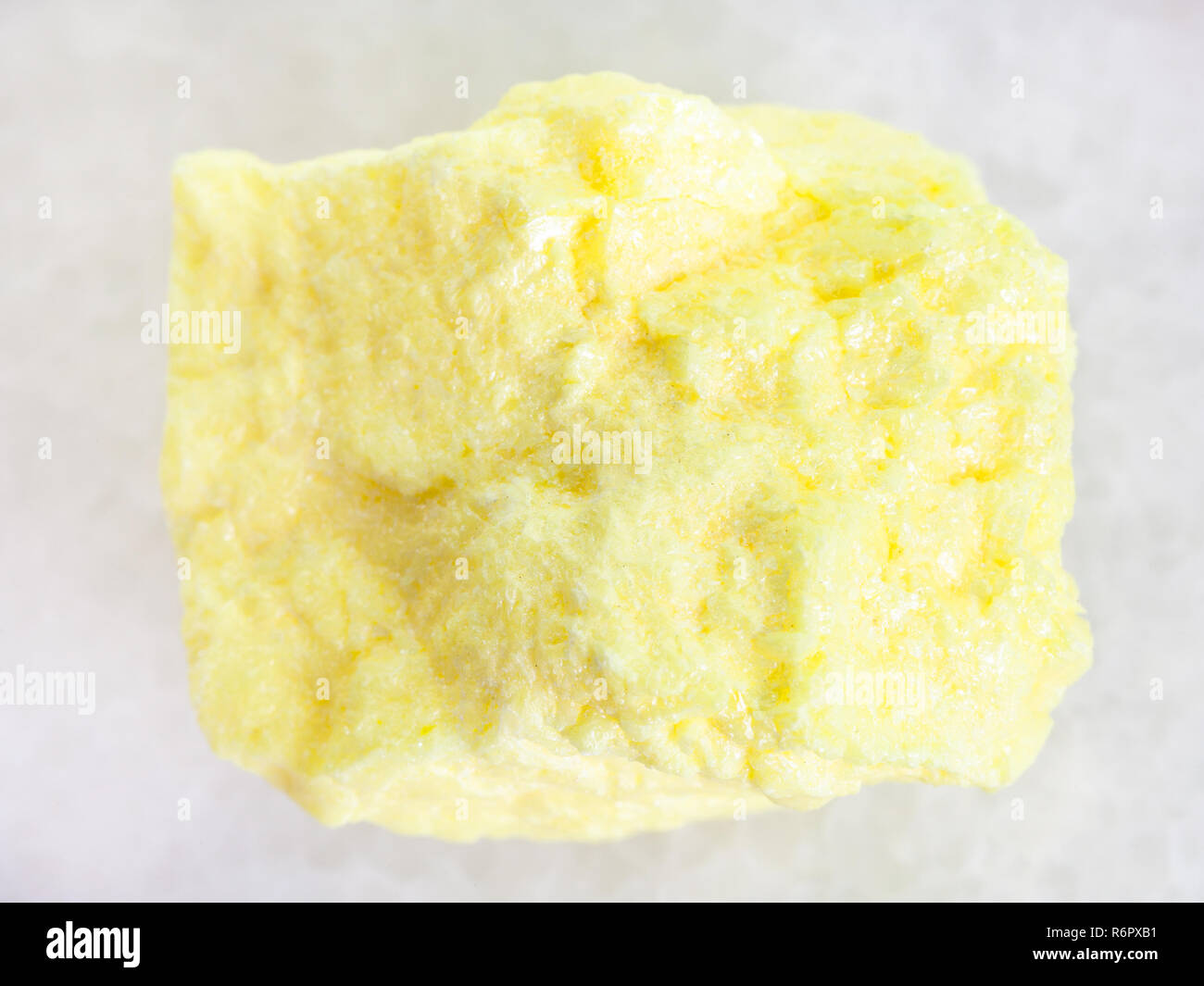 raw native Sulphur stone on white marble Stock Photo - Alamy