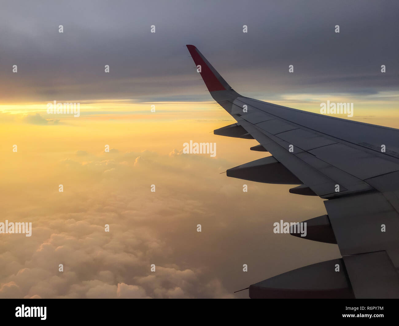 High altitude in flight passenger jet airliner airplane wing, with a ...