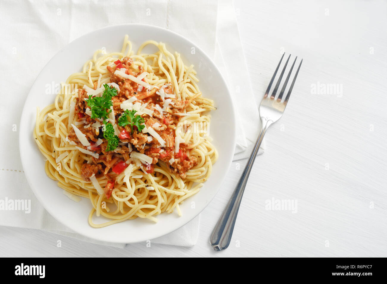 spaghetti with sauce from minced meat and tomato, parmesan and parsley ...