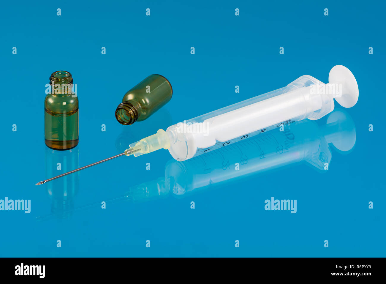 Syringe with a serum in vials Stock Photo - Alamy