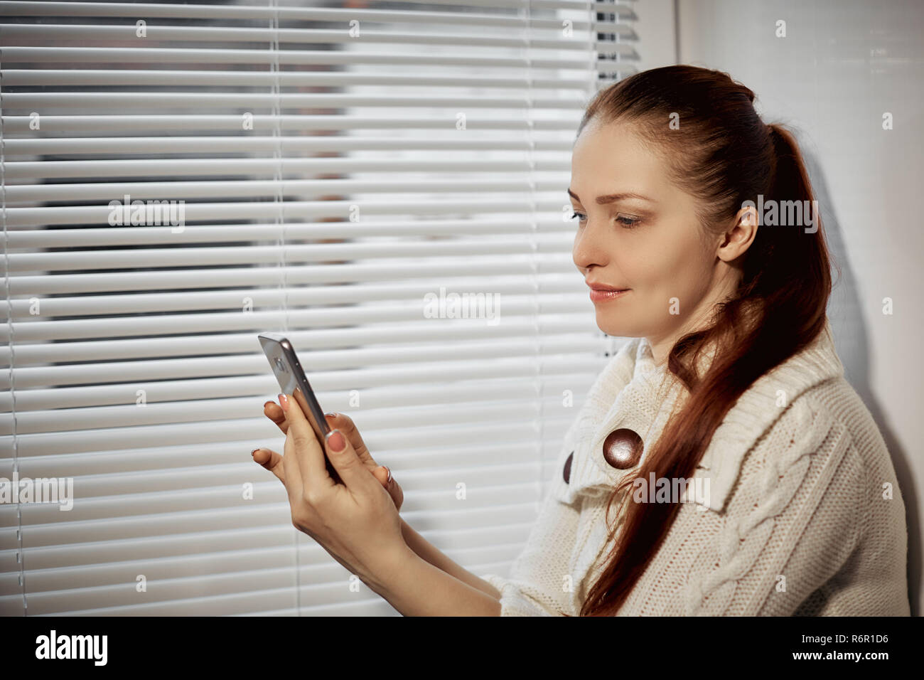online shopping, a young woman browsing the goods in the online store ...