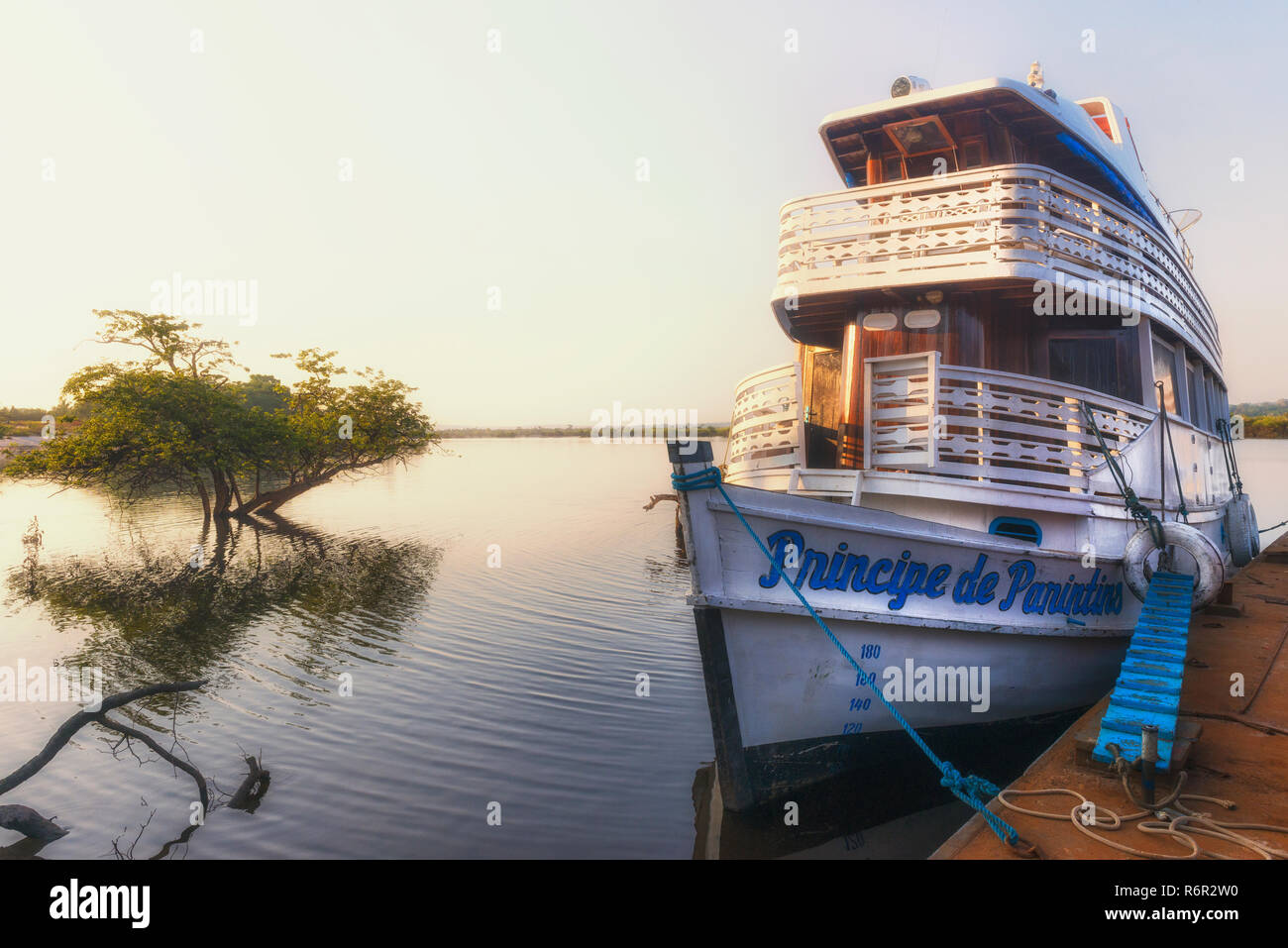 Traditional wood boat navigating on the Amazon river, Amazona state ...
