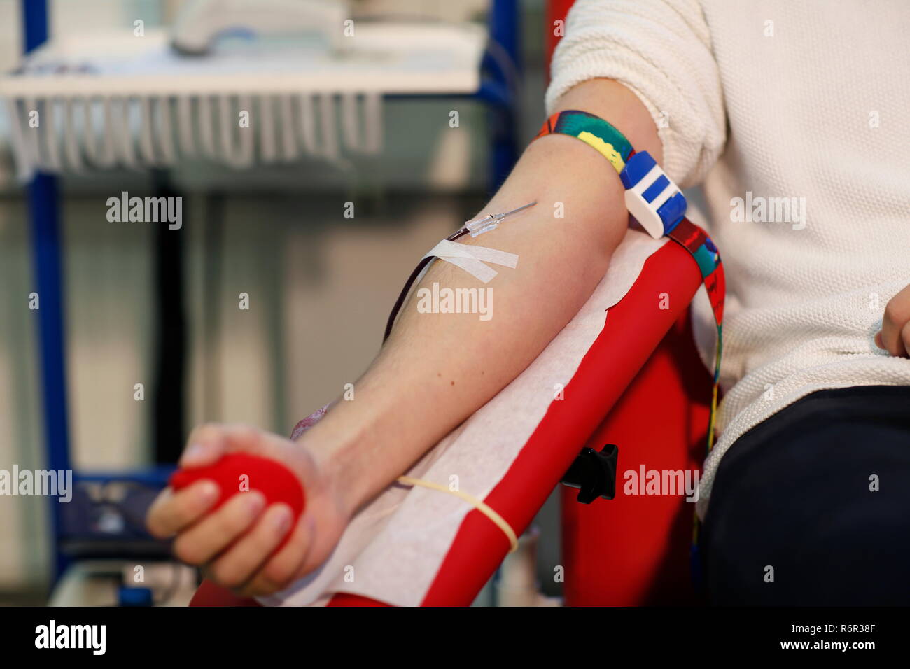 Patient with an infusion needle taking a blood sample at the ...