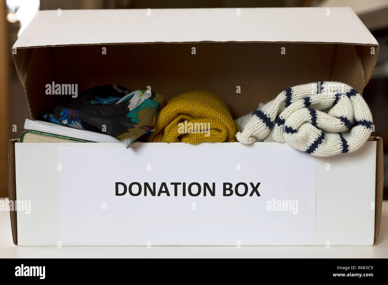 Child donating books hi-res stock photography and images - Alamy
