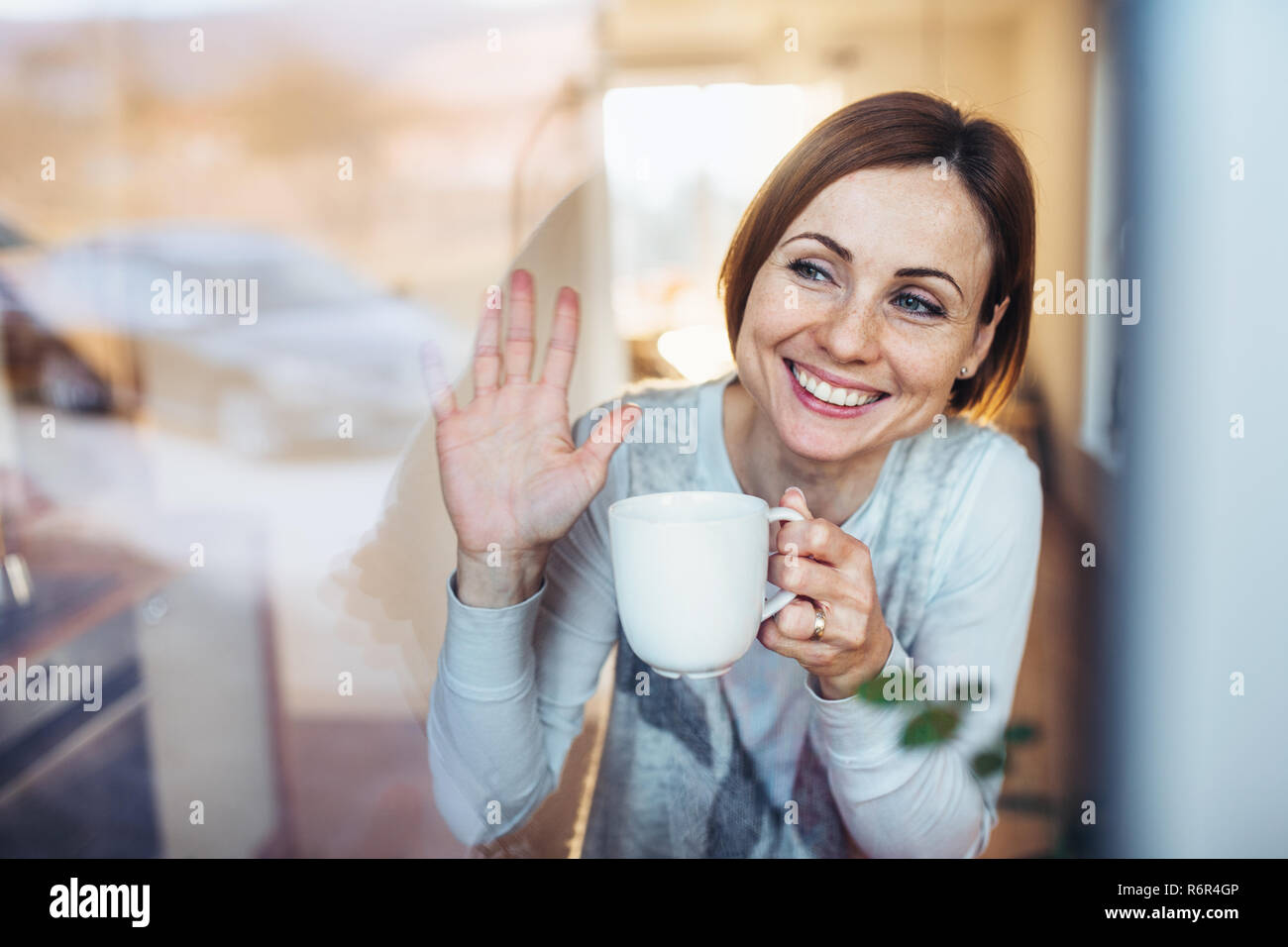 Waving goodbye adult hi-res stock photography and images - Alamy