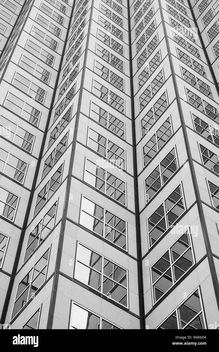 perspective wide angle view to steel blue background of glass high rise ...