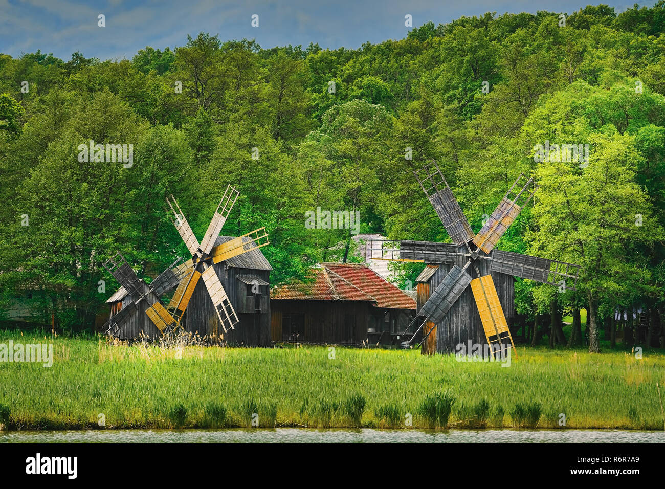 Windmills on the Bank of Lake Stock Photo - Alamy