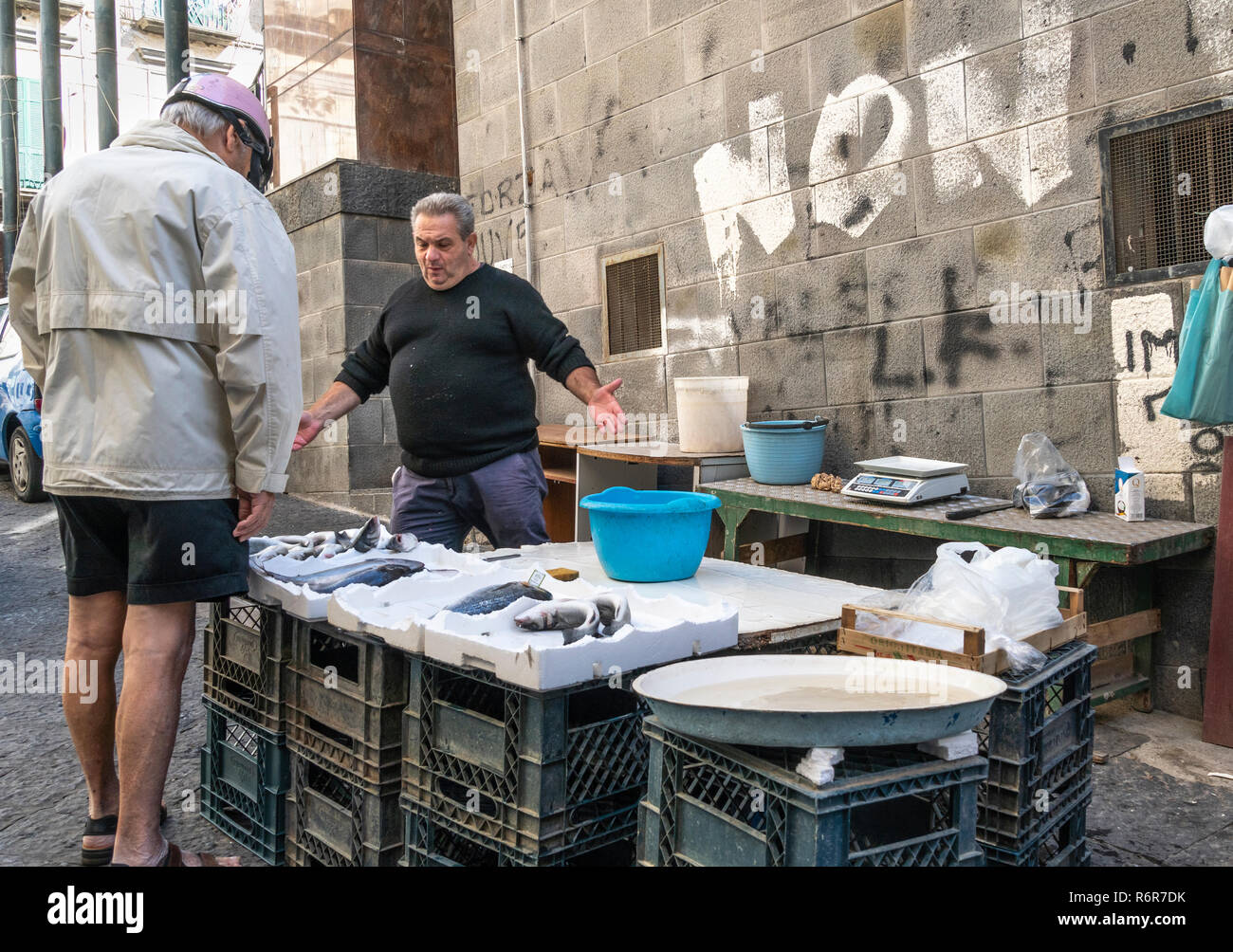 Street vendor selling fish on the Vico Tratoio in the Quartieri ...