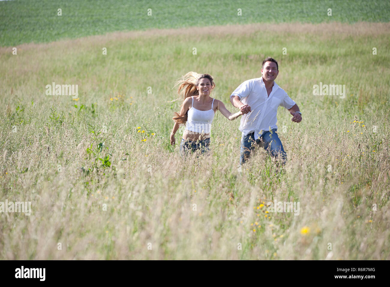 Happy People on summer Meadow Stock Photo - Alamy