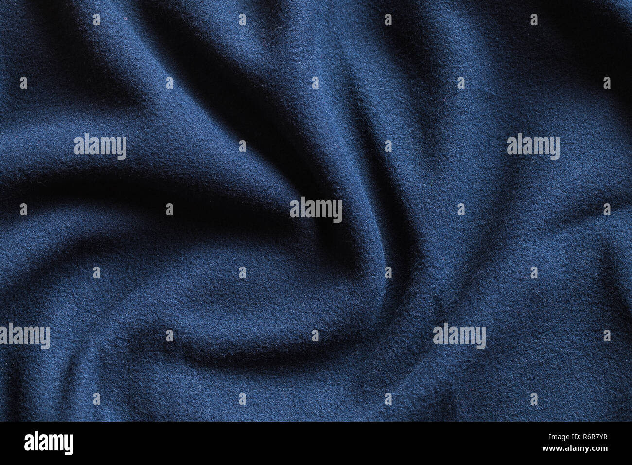 Texture of fleece, dark blue soft napped insulating fabric made from ...