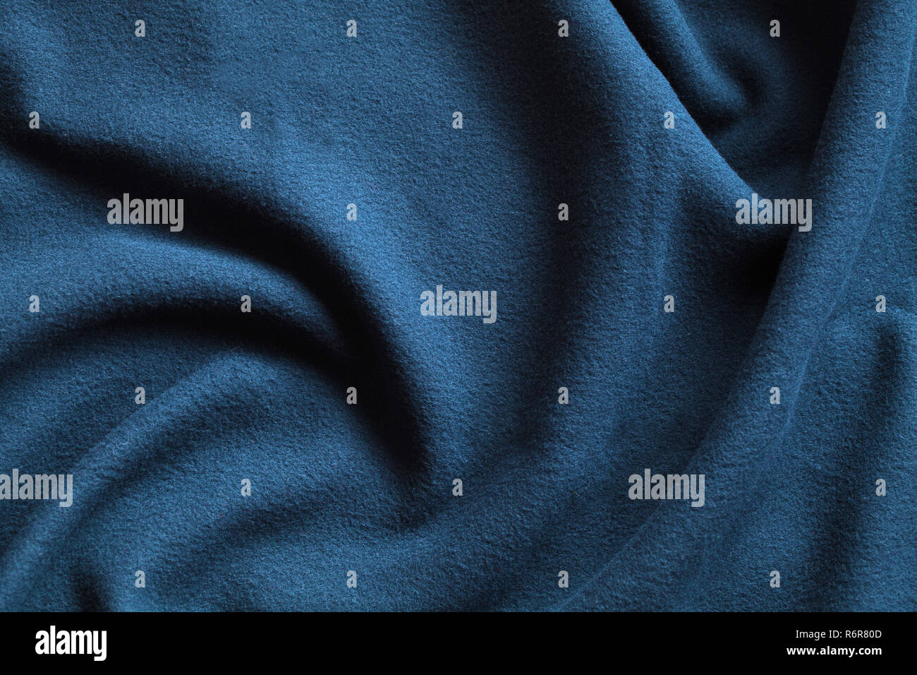 Texture of fleece, blue soft napped insulating fabric made from ...