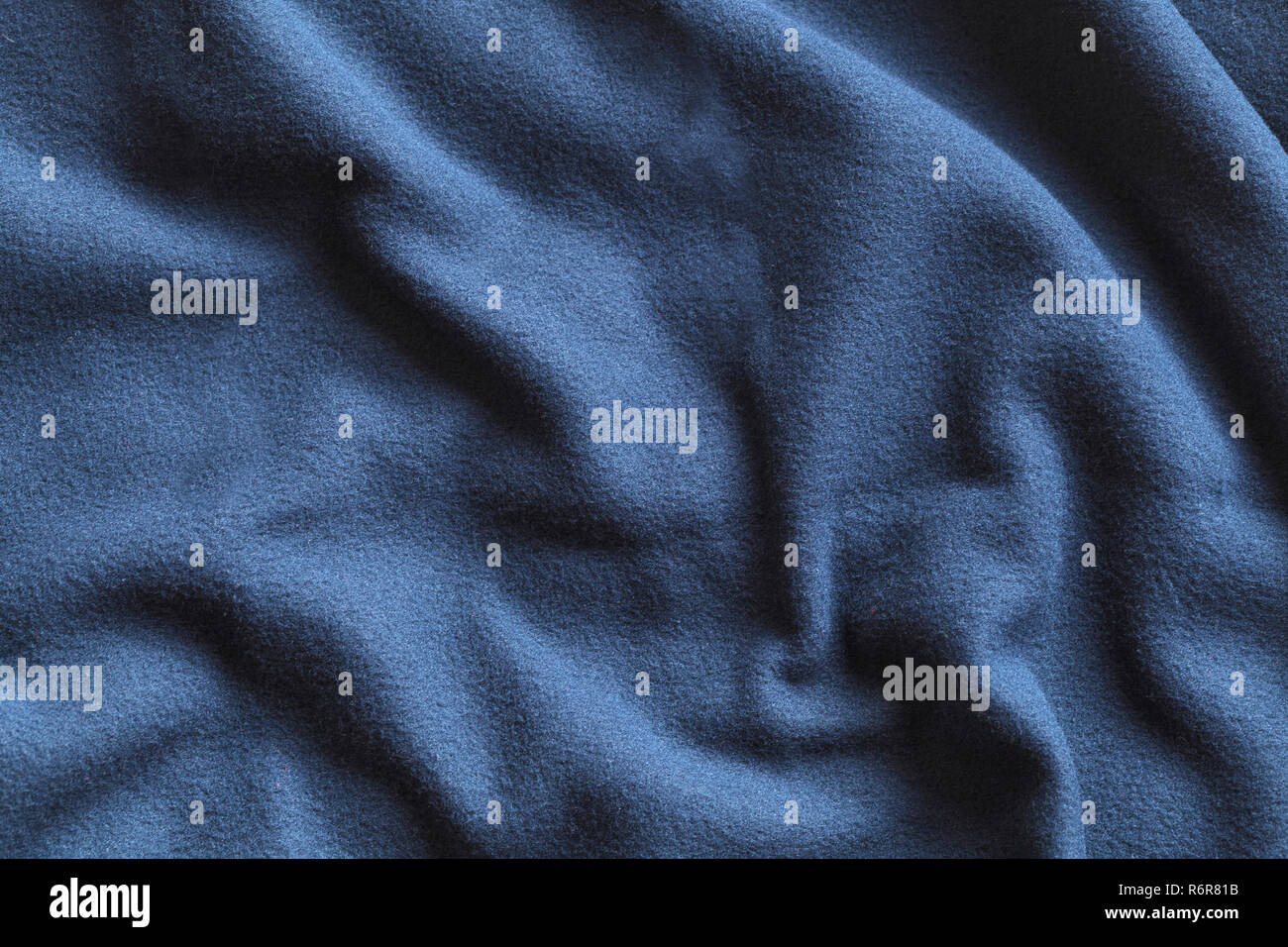 Texture of blue fleece, soft napped insulating fabric made of polyester ...