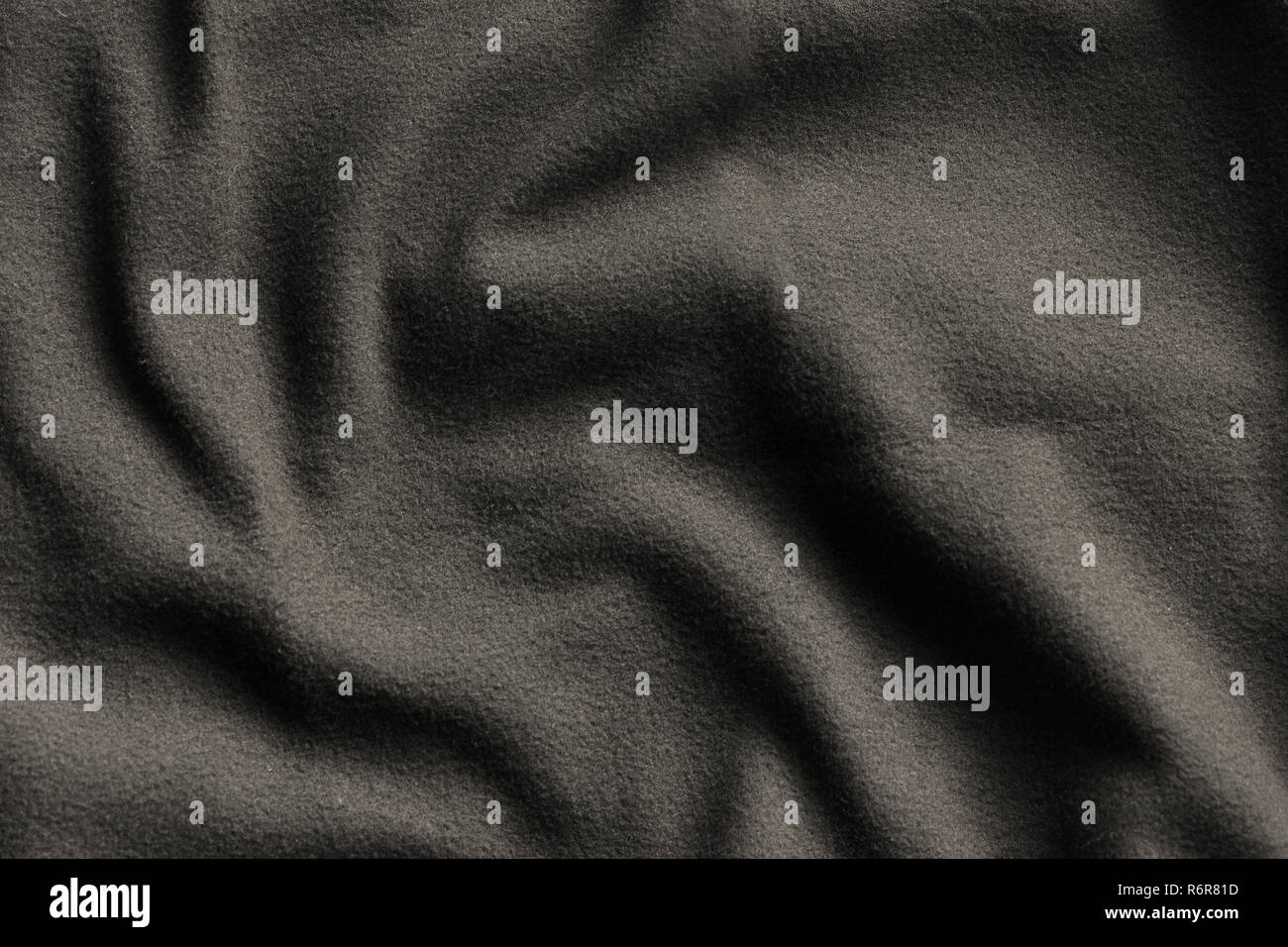 Texture of dark brown fleece, soft napped insulating fabric made from ...