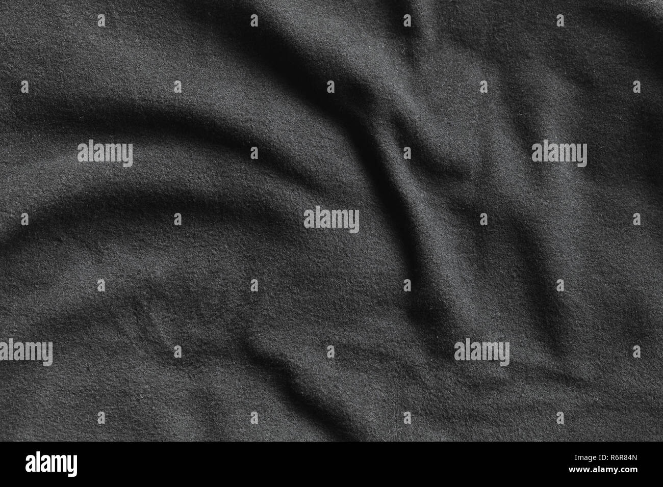 Texture of dark gray fleece, soft napped insulating fabric made from ...
