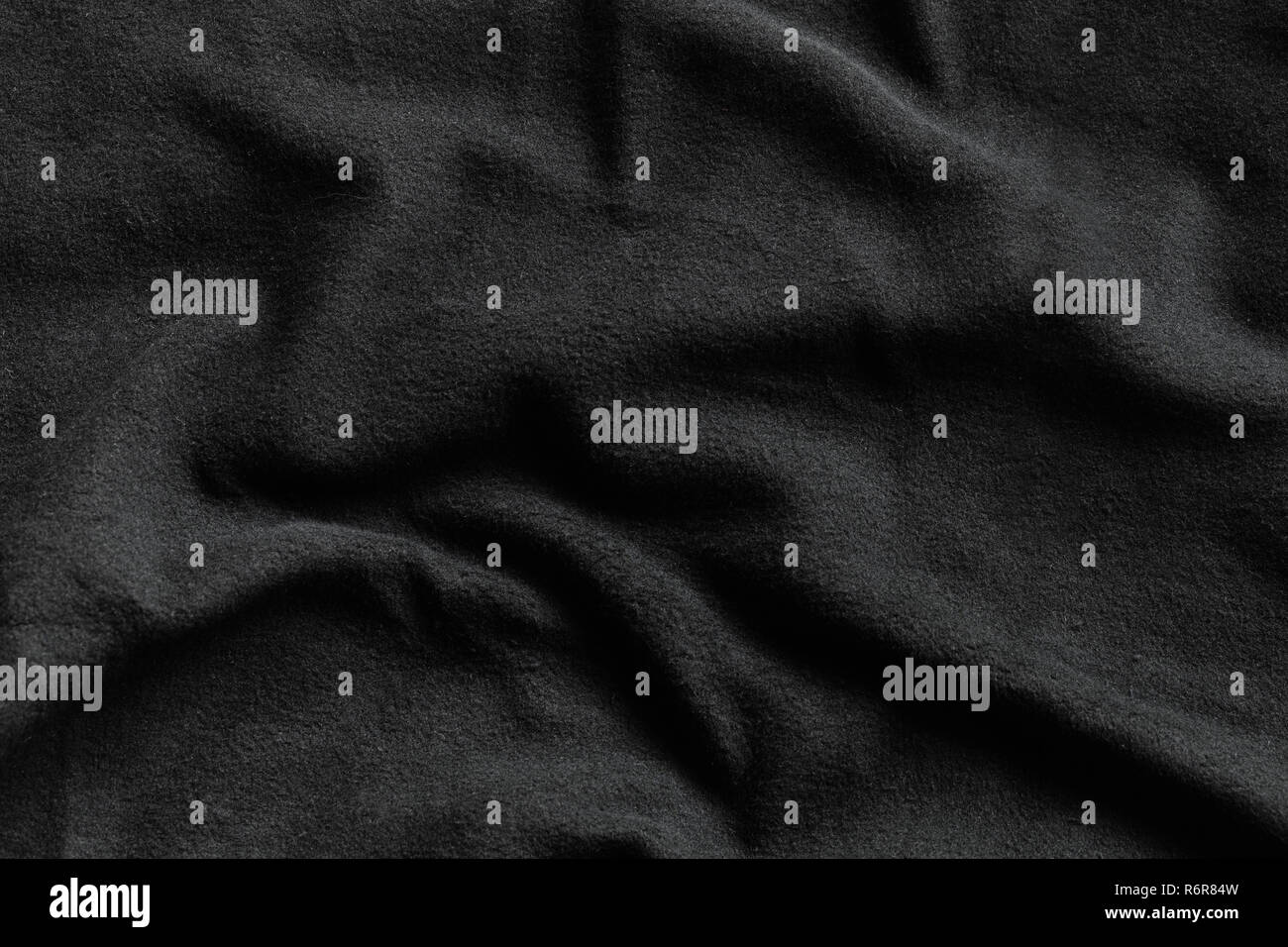 Black fleece texture, soft napped insulating fabric made from polyester ...