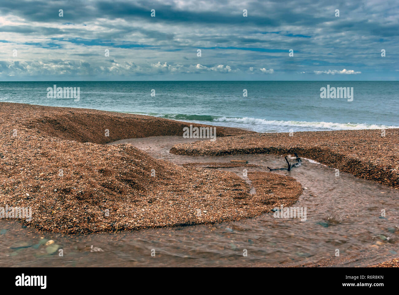 Fresh water stream going into the sea - Cornwall, United Kingdom Stock ...
