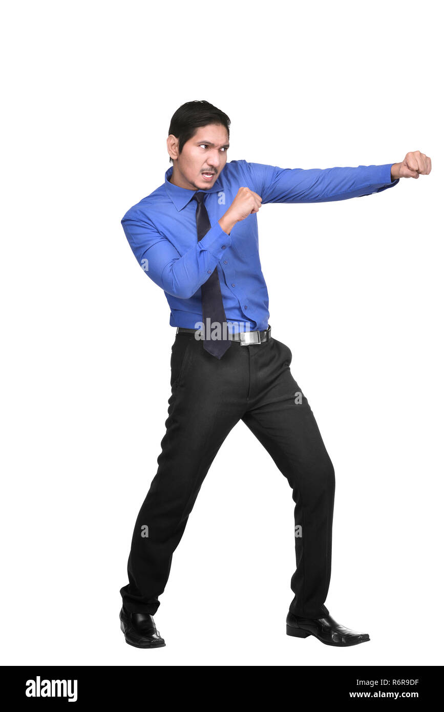 Attractive asian businessman punching something Stock Photo - Alamy