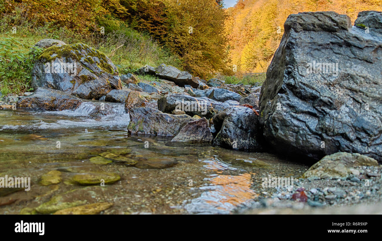 Rocks in a little river stream Stock Photo - Alamy