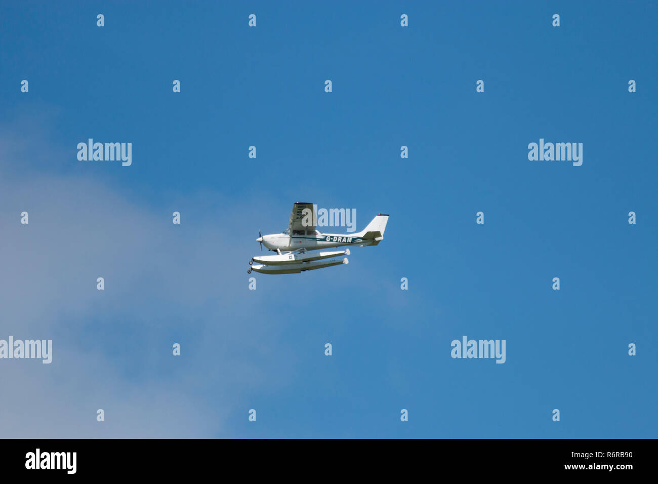 Cessna 206 on amphibious floats, seaplane, Hydravion in blue sky Stock ...