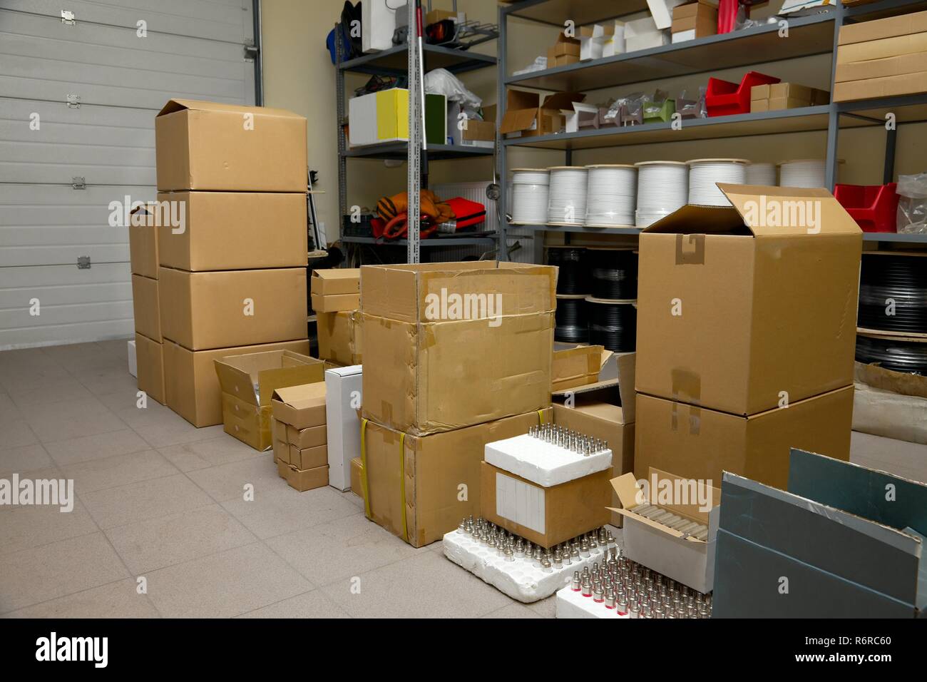 Warehouse with equipment storage Stock Photo - Alamy