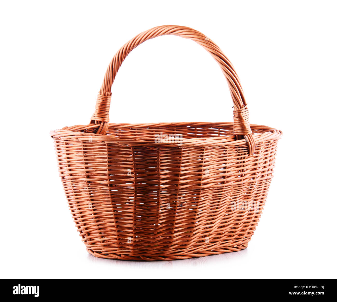 Empty wicker basket isolated on white Stock Photo - Alamy