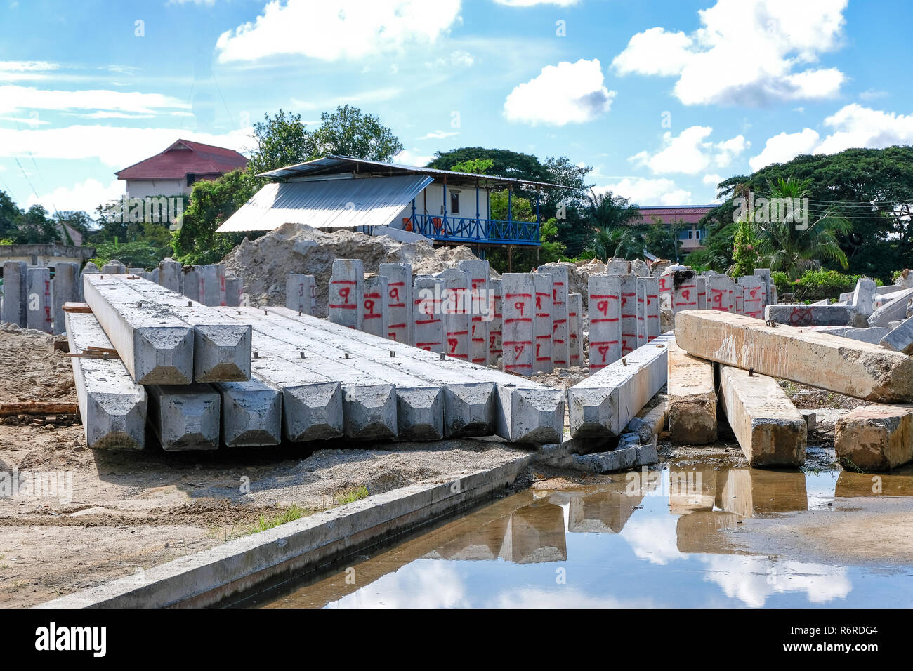 concrete foundation piles are under the ground for a new building on ...