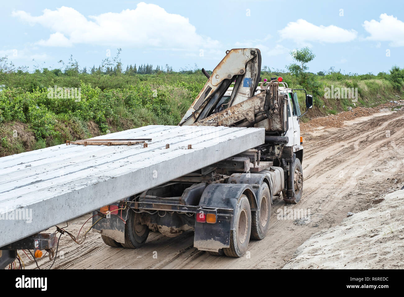 Concrete piles are transporting on trailer truck Stock Photo - Alamy